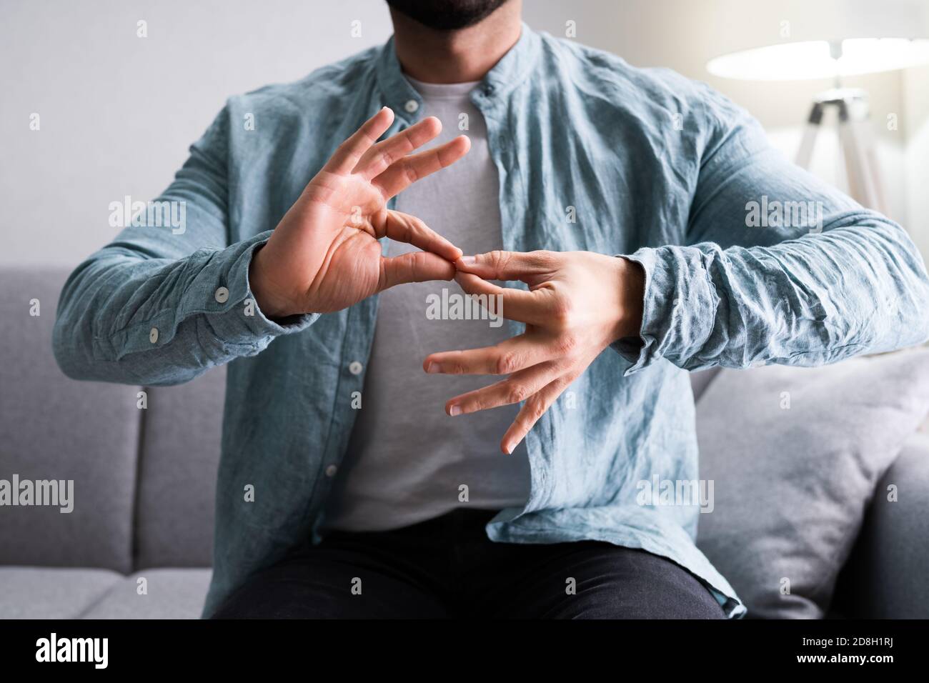 Adult Learning Sign Language For Deaf Disabled Stock Photo - Alamy