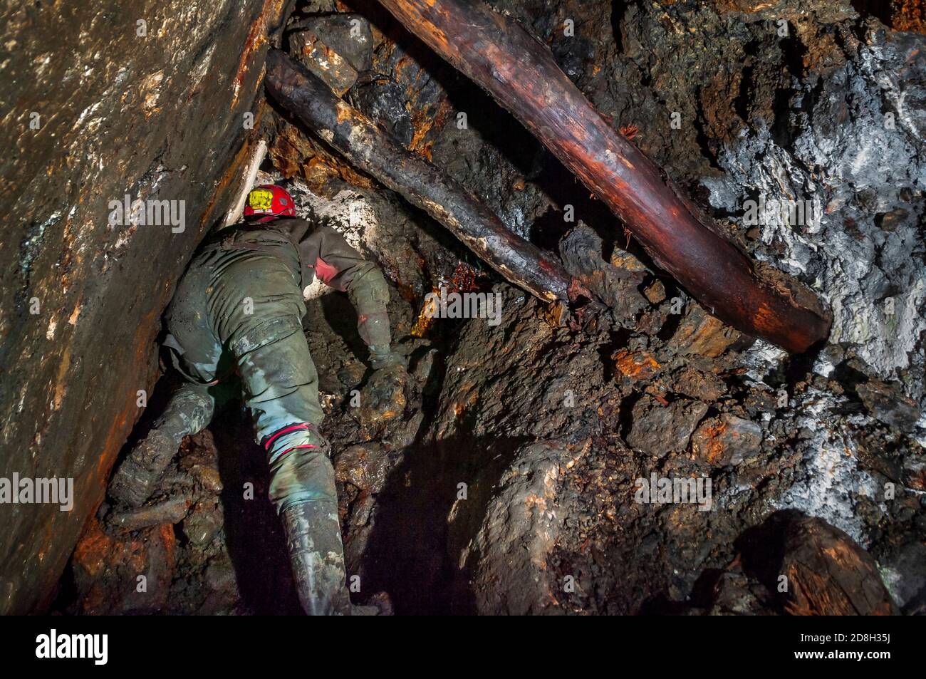 Solid wooden 'stemples' holding up a roof of waste rock and loose shale ...