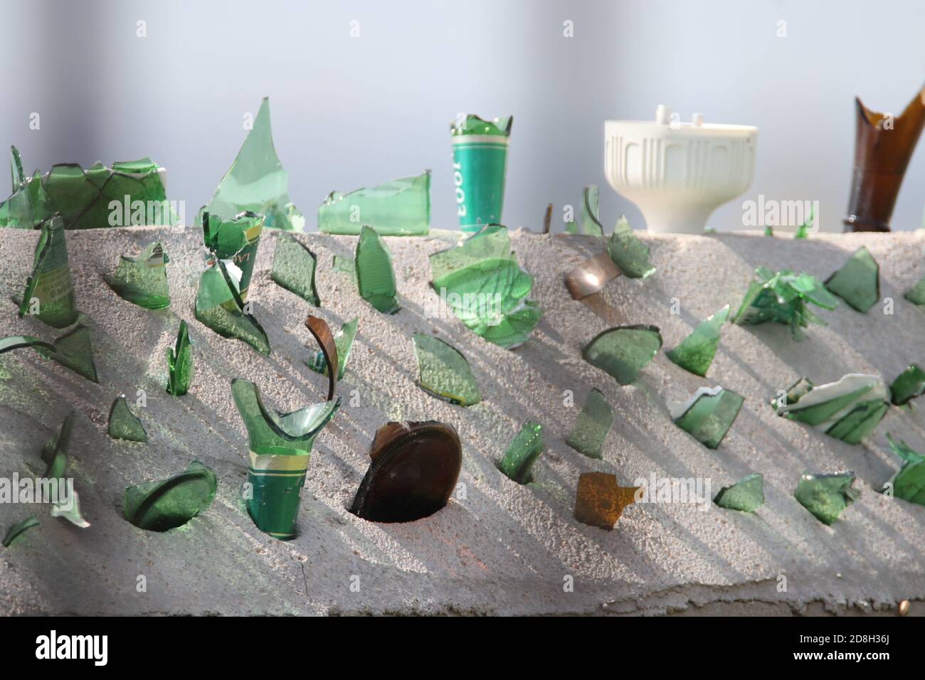 A wall's top was filled with hundreds of meters of glass shards to ...