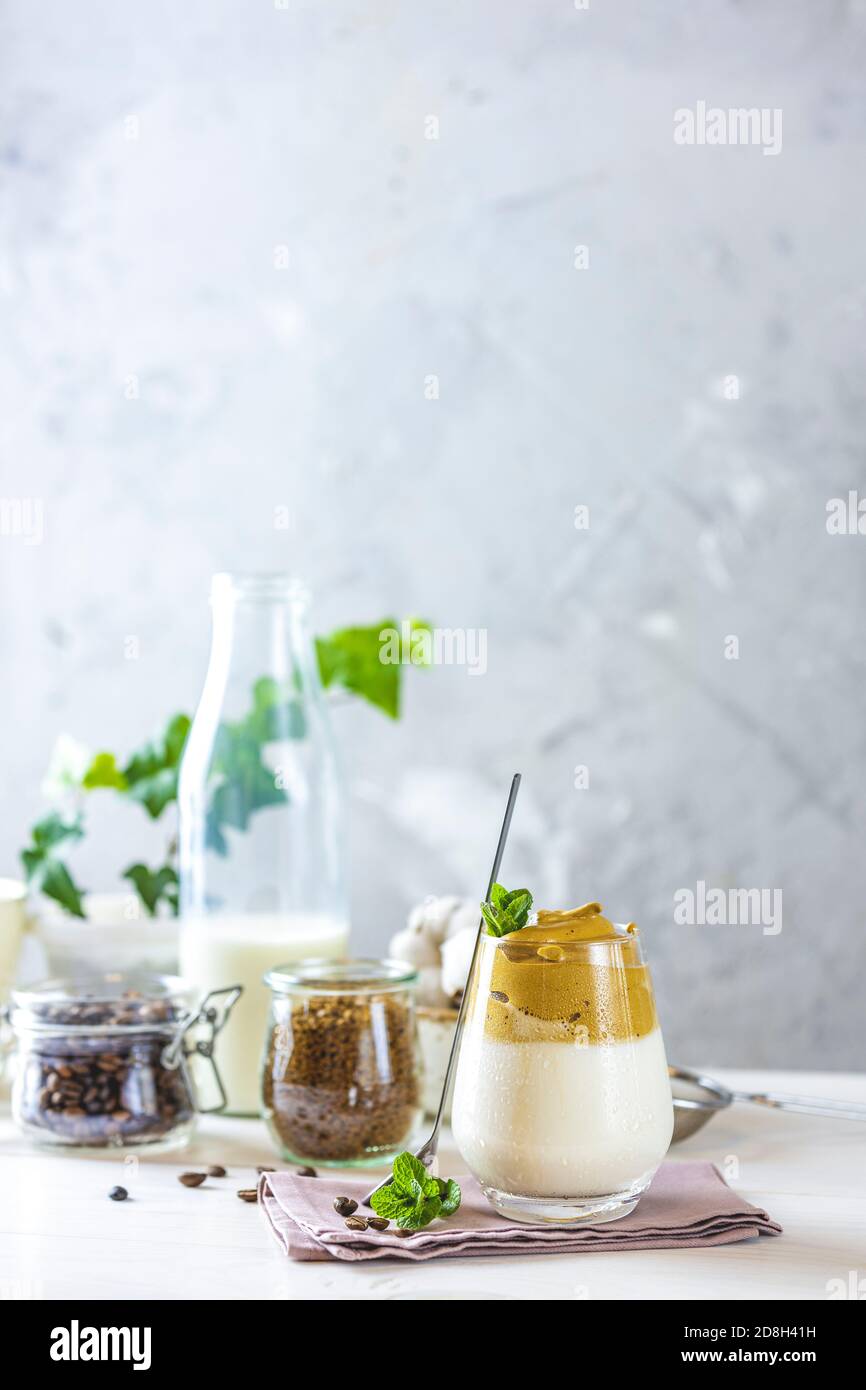 Glass of Iced Dalgona Coffee, a trendy fluffy creamy whipped coffee ...