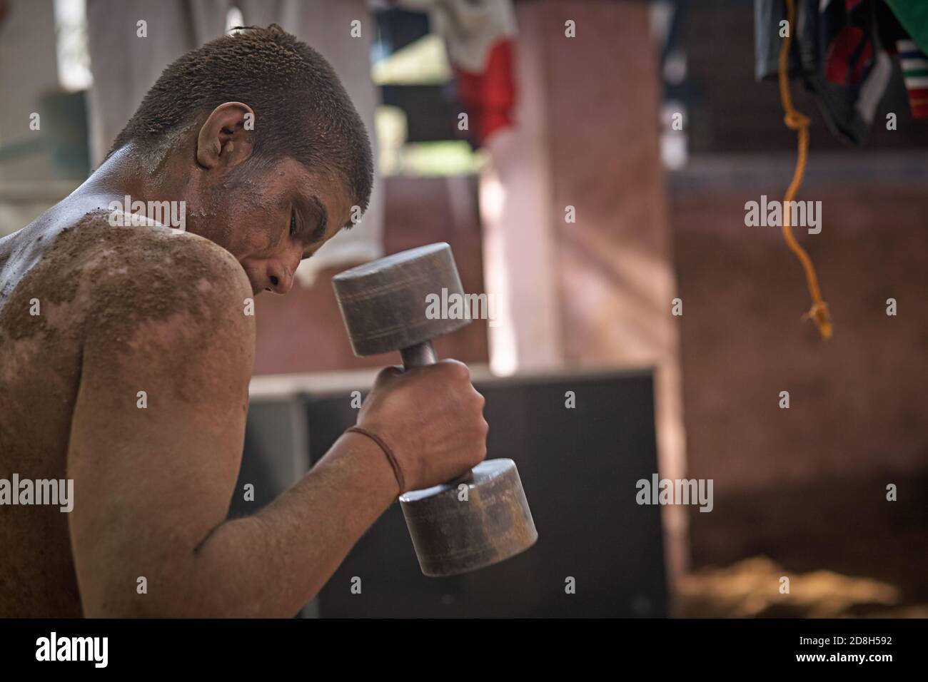 Delhi, India, May 2012. Kushti wrestler in the akhara in his daily ...