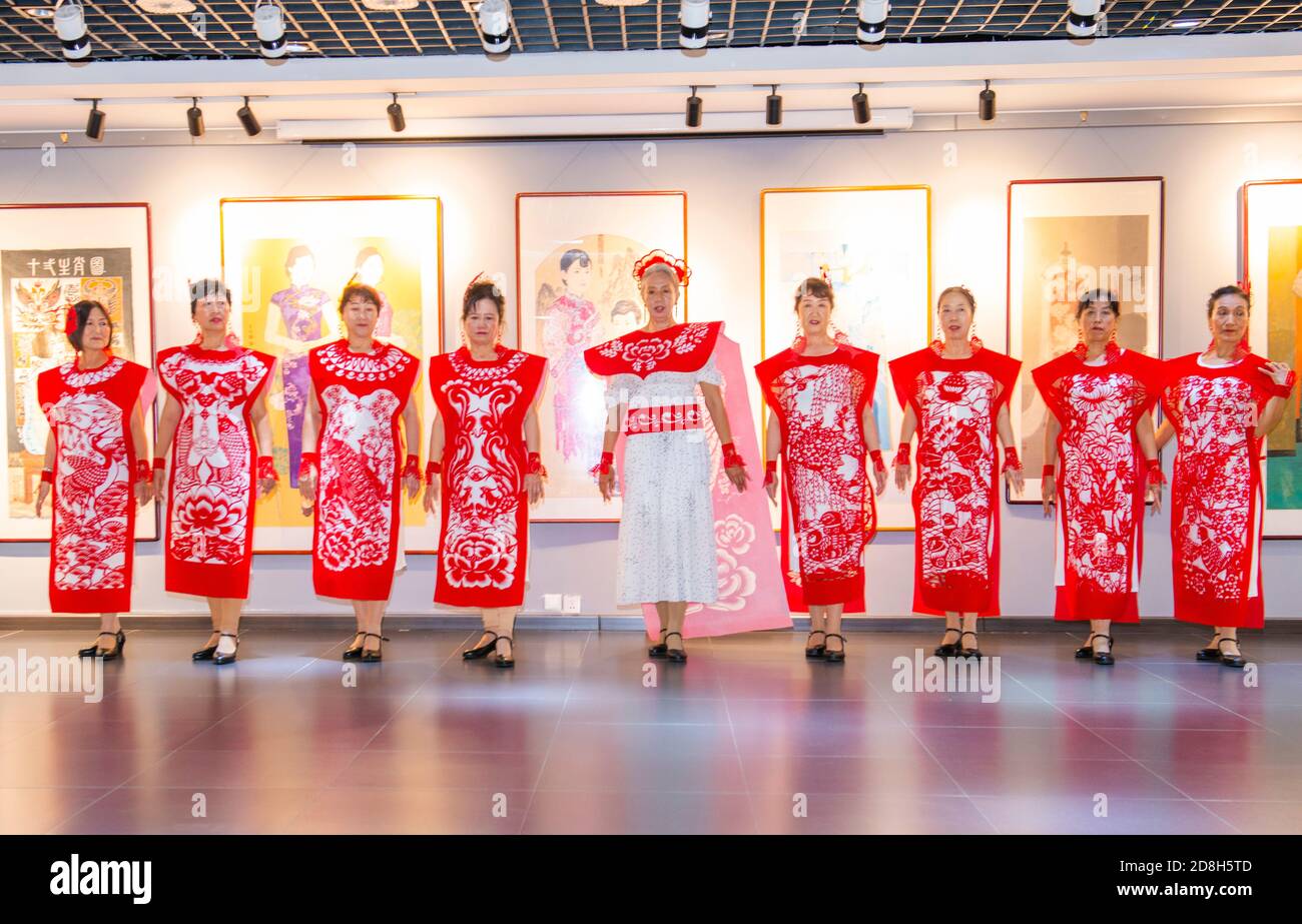 Elder models present papercut qipao or Chinese long gown at Shenyang ...