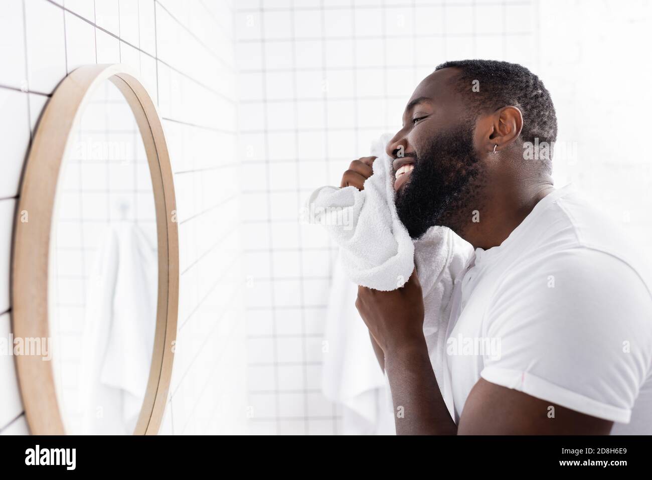 Young man drying face towel hi-res stock photography and images - Alamy