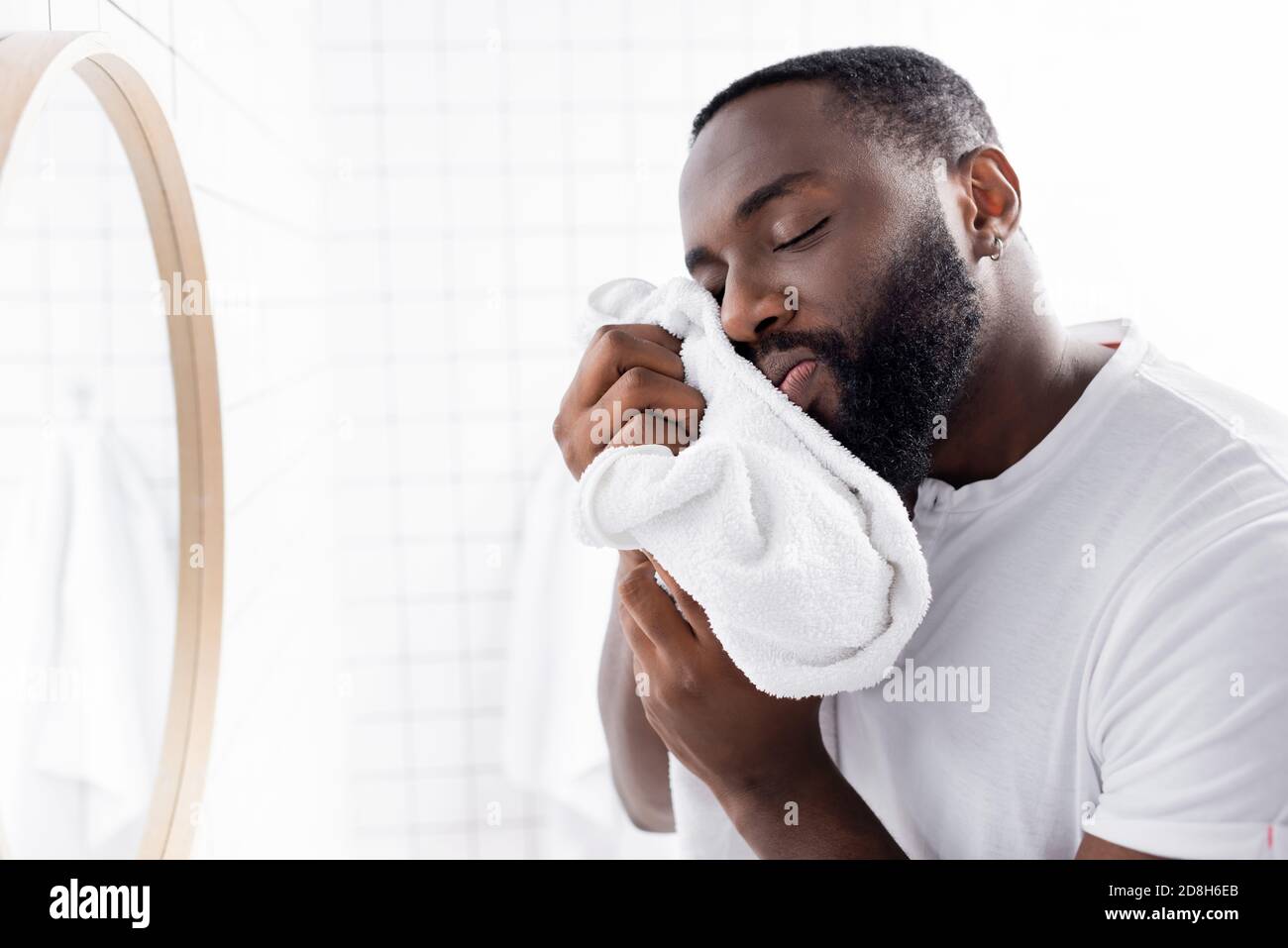 Young man drying face towel hi-res stock photography and images - Alamy