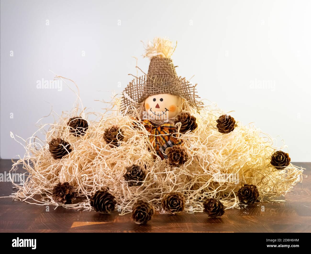 Mini Stuffed Scarecrow with burlap hat Sitting in Pile of Straw with ...