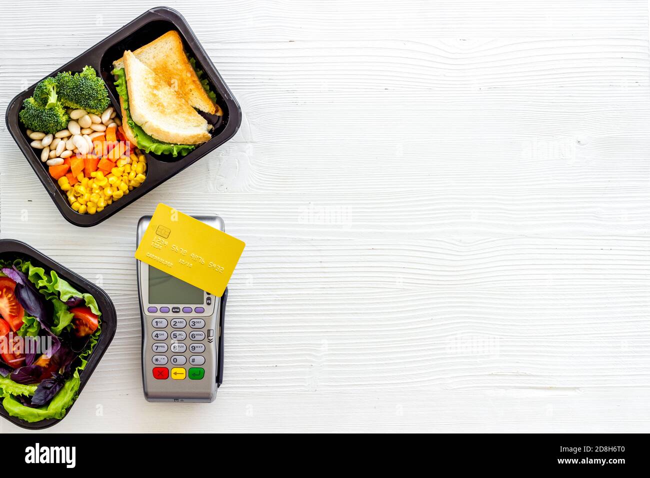 Food delivery payment with terminal and lunch boxes with meal Stock ...