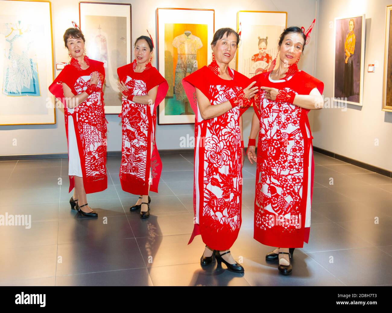 Elder models present papercut qipao or Chinese long gown at Shenyang ...