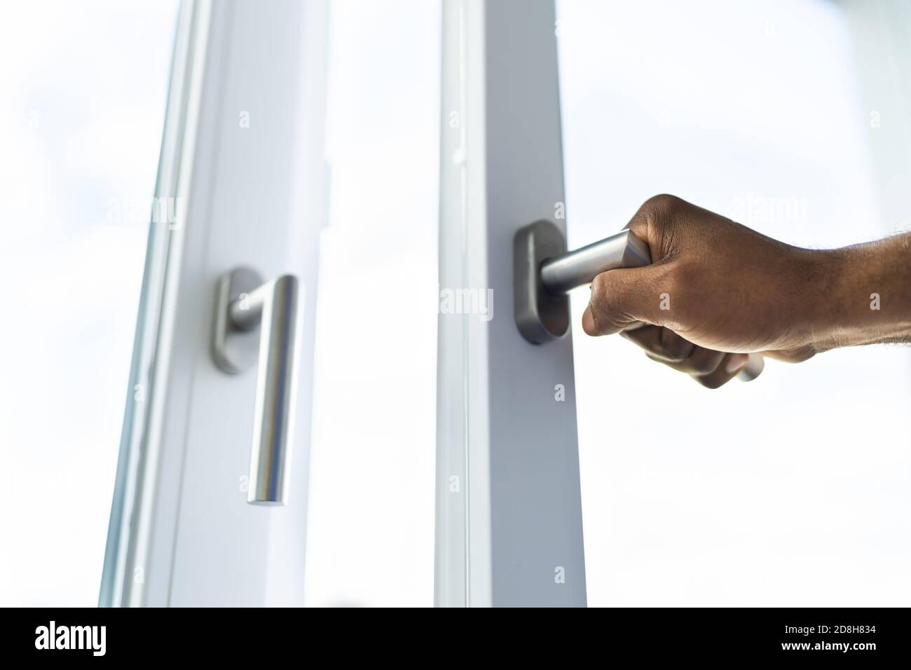 African American Man Opening Office Window Side View Stock Photo - Alamy