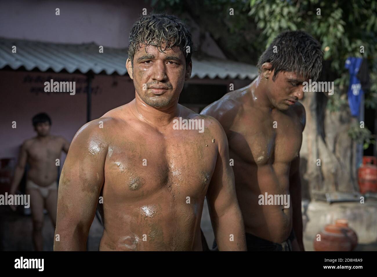 Delhi, India, May 2012. Kushti wrestlers resting in the akhara in his ...