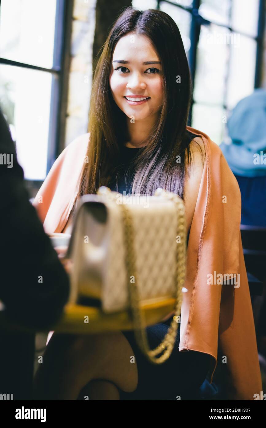 Beautiful model photoshoot at local cafe Stock Photo - Alamy