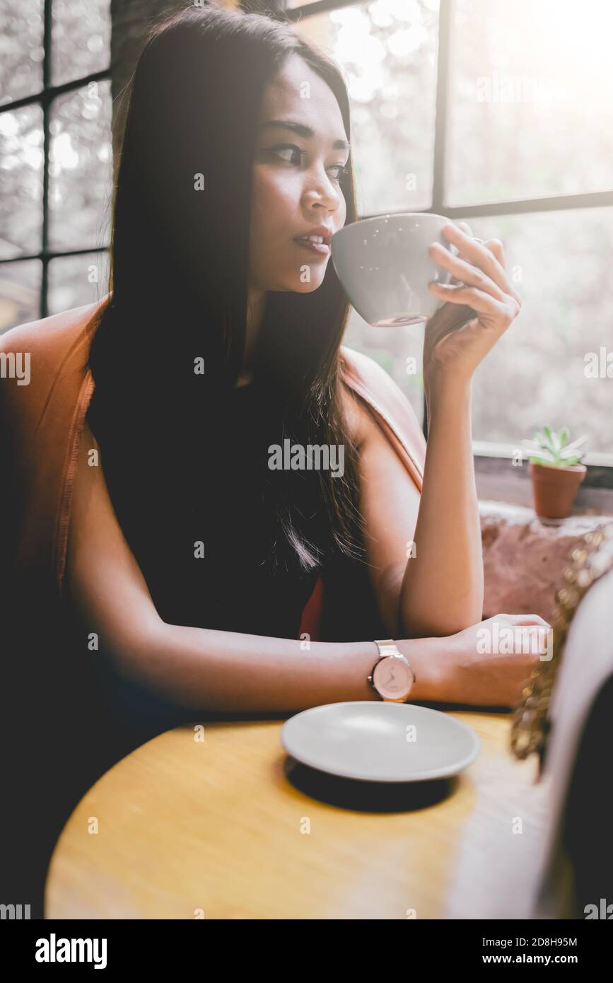 Beautiful model photoshoot at local cafe Stock Photo - Alamy