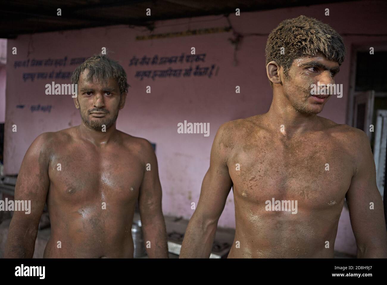 Delhi, India, May 2012. Kushti wrestlers resting in the akhara in his ...
