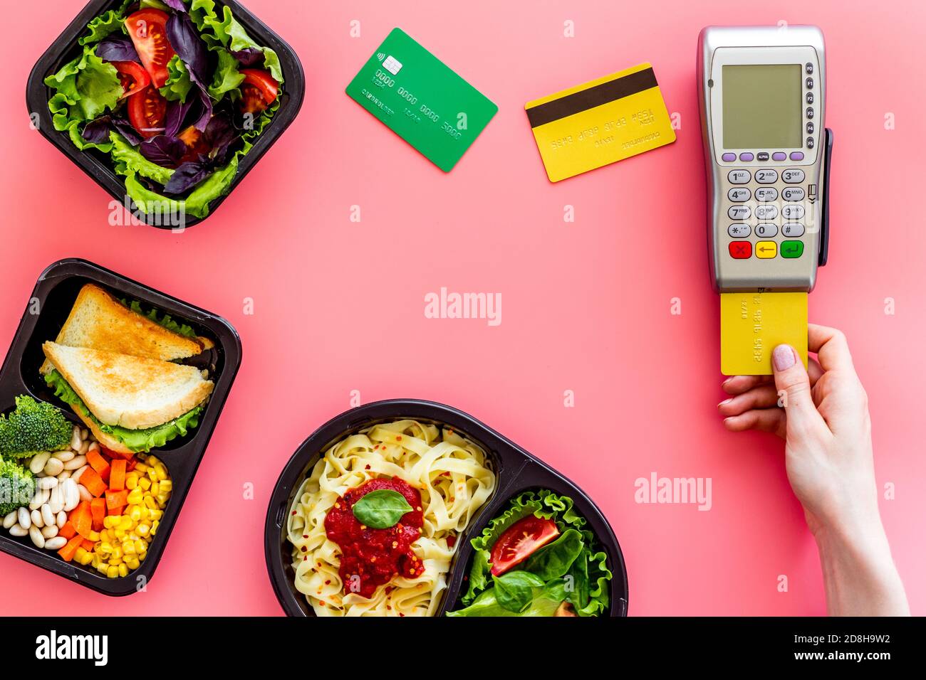 Food delivery payment with terminal and lunch boxes with meal Stock ...