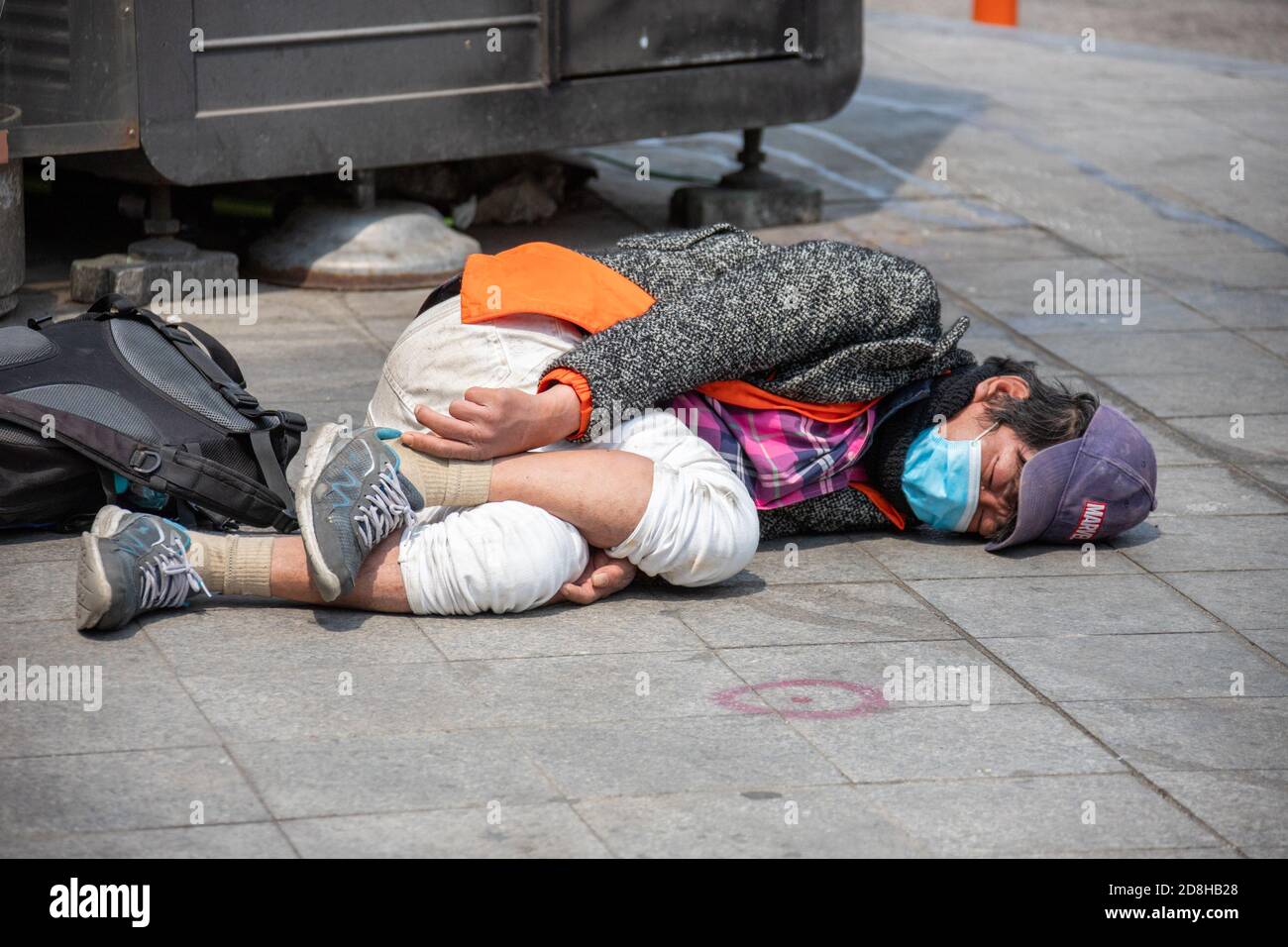 Homeless man wearing a mask during the Coronavirus pandemic, Seoul ...