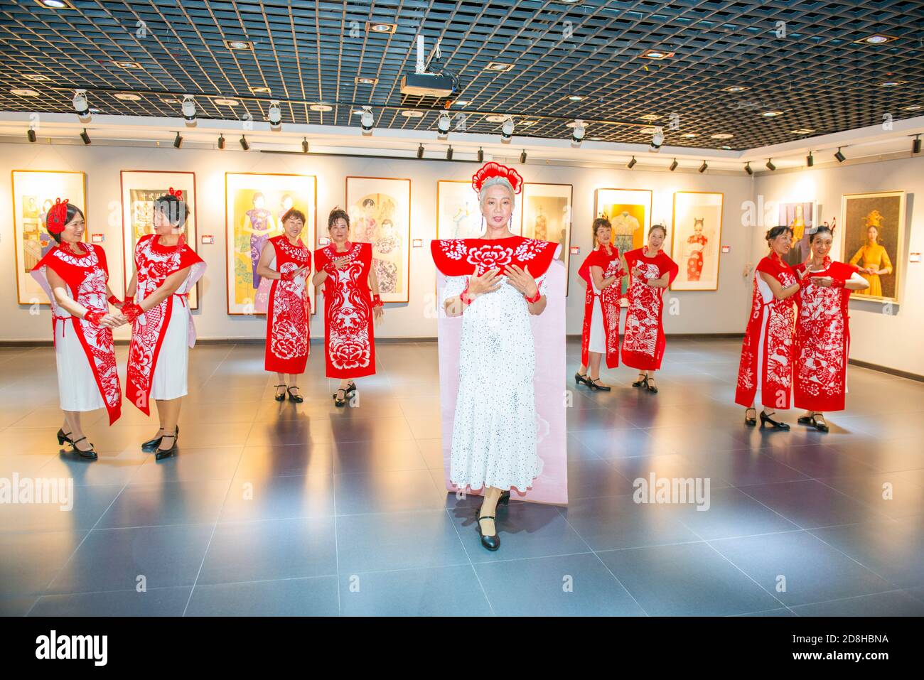 Elder models present papercut qipao or Chinese long gown at Shenyang ...