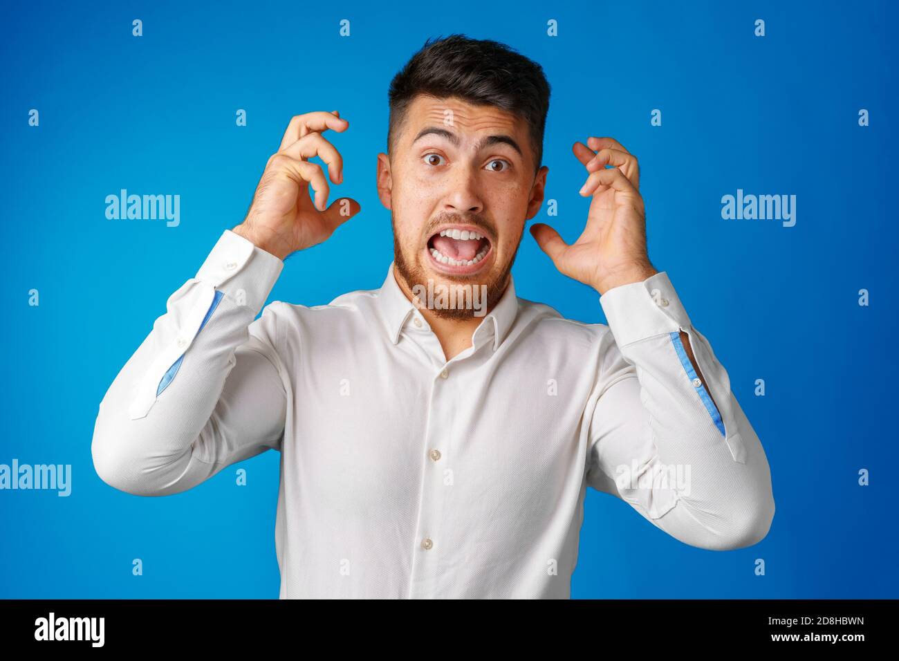 Angry furious hispanic man in rage portrait Stock Photo - Alamy