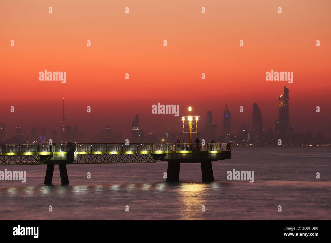 Skyline of Kuwait City at sunset with pier Stock Photo - Alamy