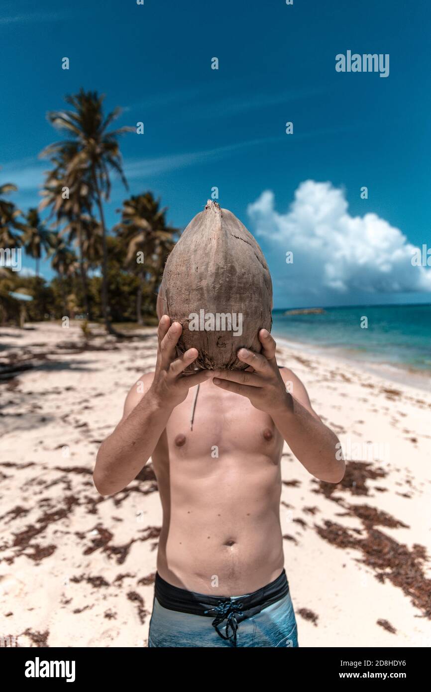 Man on coconut tree hi-res stock photography and images - Alamy