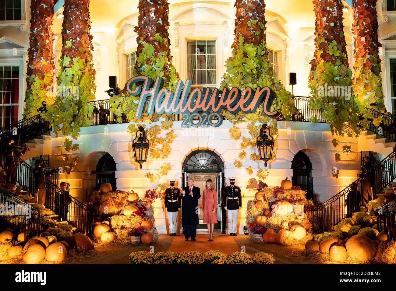 U.S. President Donald Trump and First Lady Melania Trump greet trick-or ...