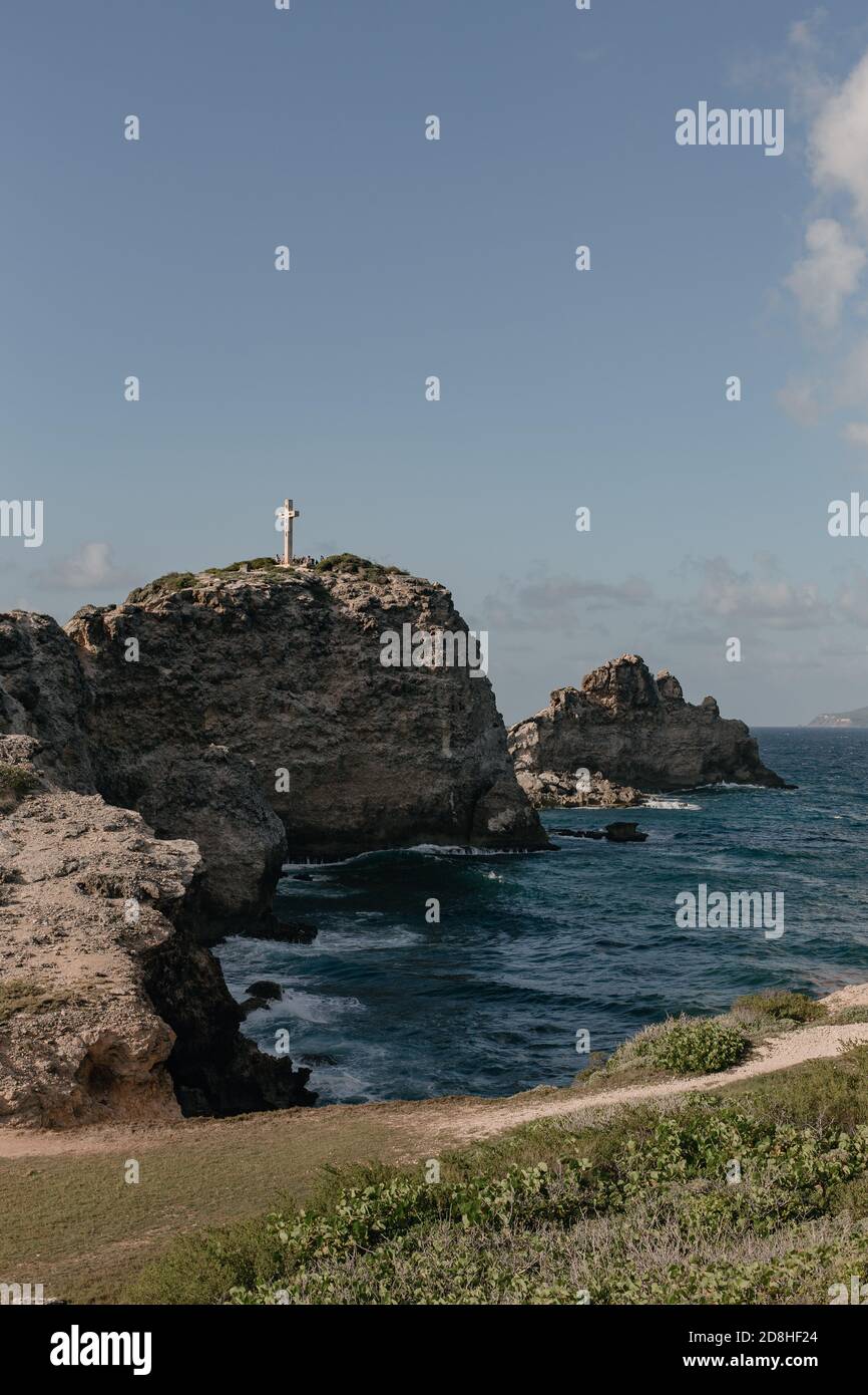 A cross on top of a big rock formation facing the Atlantic Ocean Stock ...