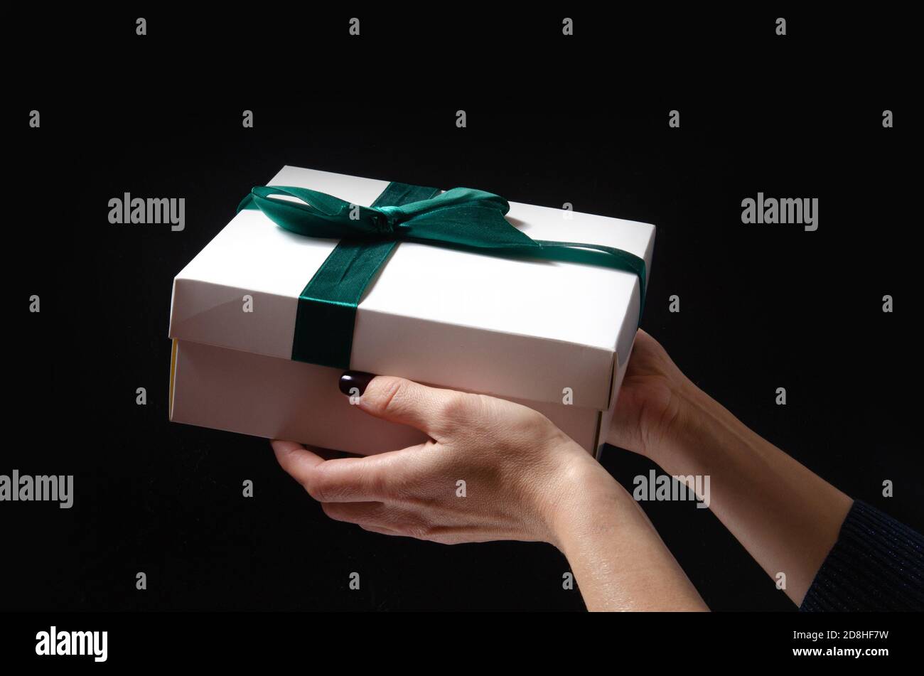 Hand holds package on black hi-res stock photography and images - Alamy