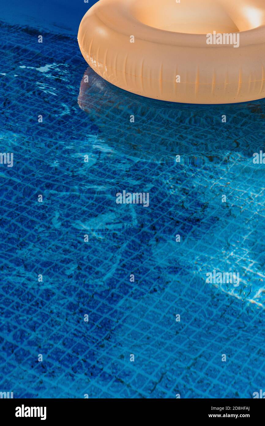 An orange pool ring in a swimming pool Stock Photo - Alamy