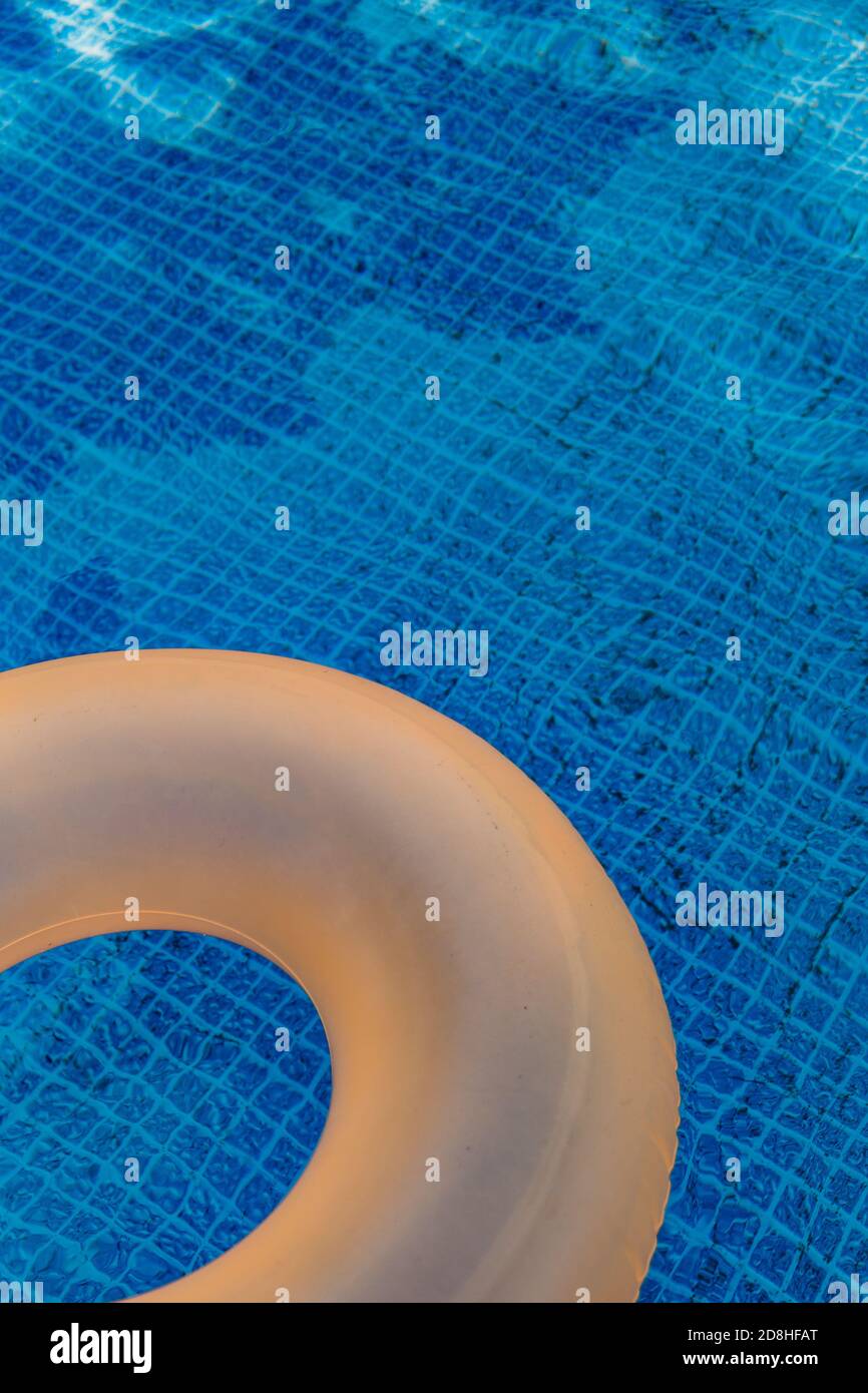 An orange pool ring in a swimming pool Stock Photo - Alamy