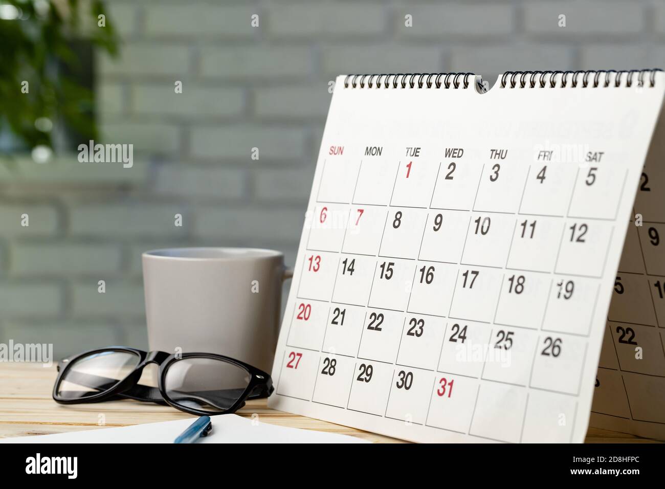 Calendar page close up on office desk Stock Photo - Alamy