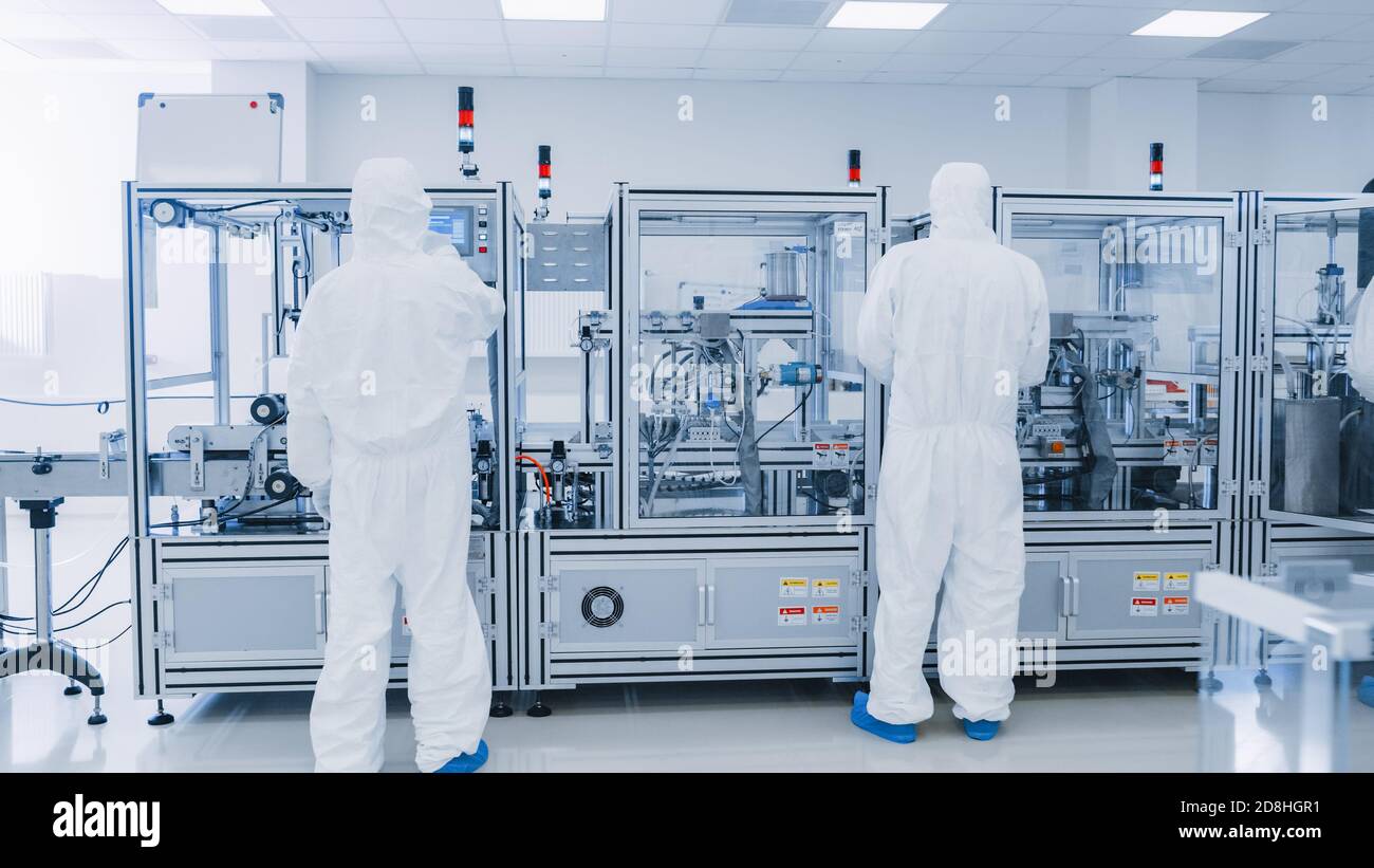 Manufacturing Laboratory where Scientists in Protective Coverall's Work ...