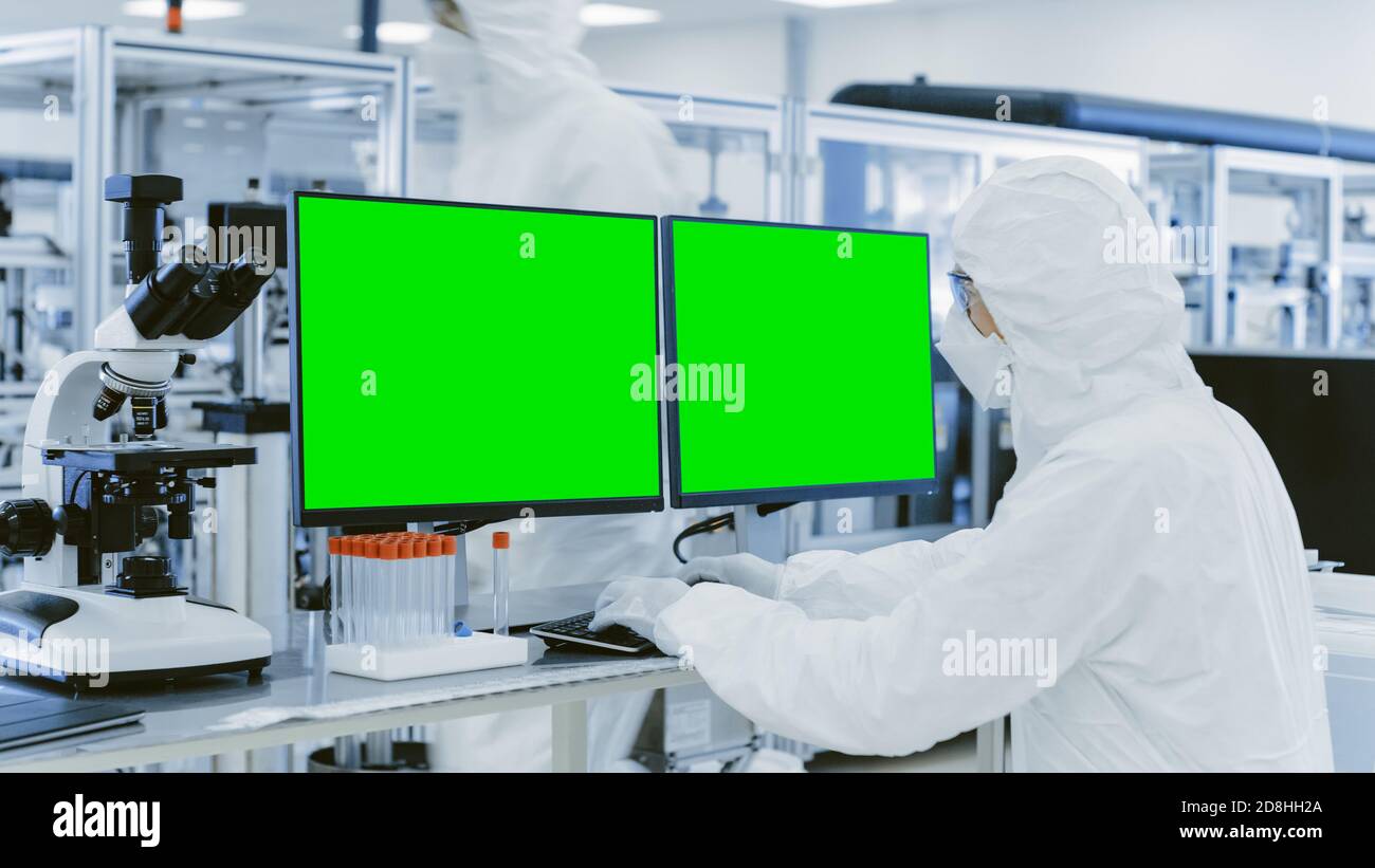 In Laboratory Over the Shoulder View of Scientist in Protective Clothes ...
