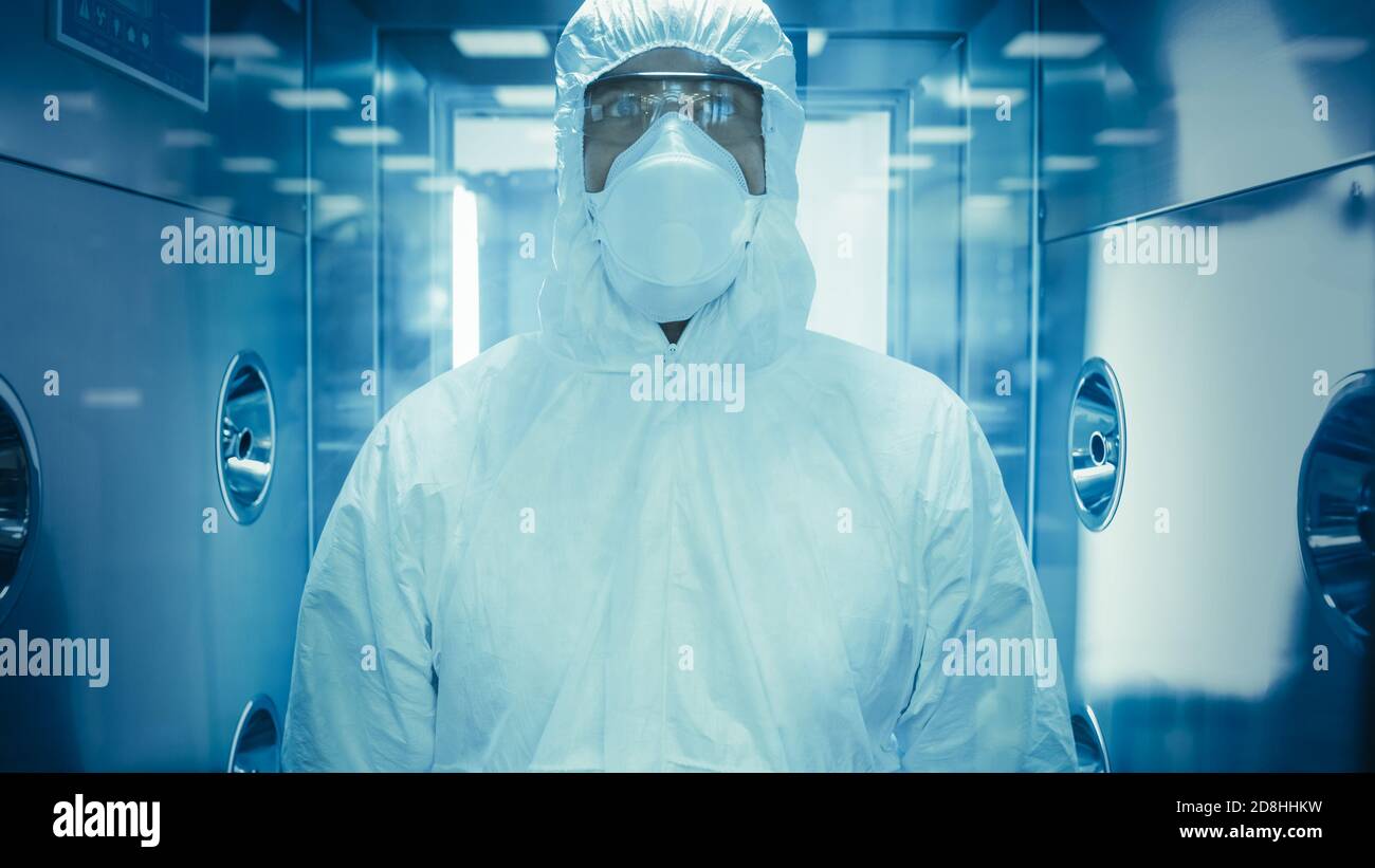 Scientist Virologist Factory Worker in Coverall Suit Disinfects Himself ...