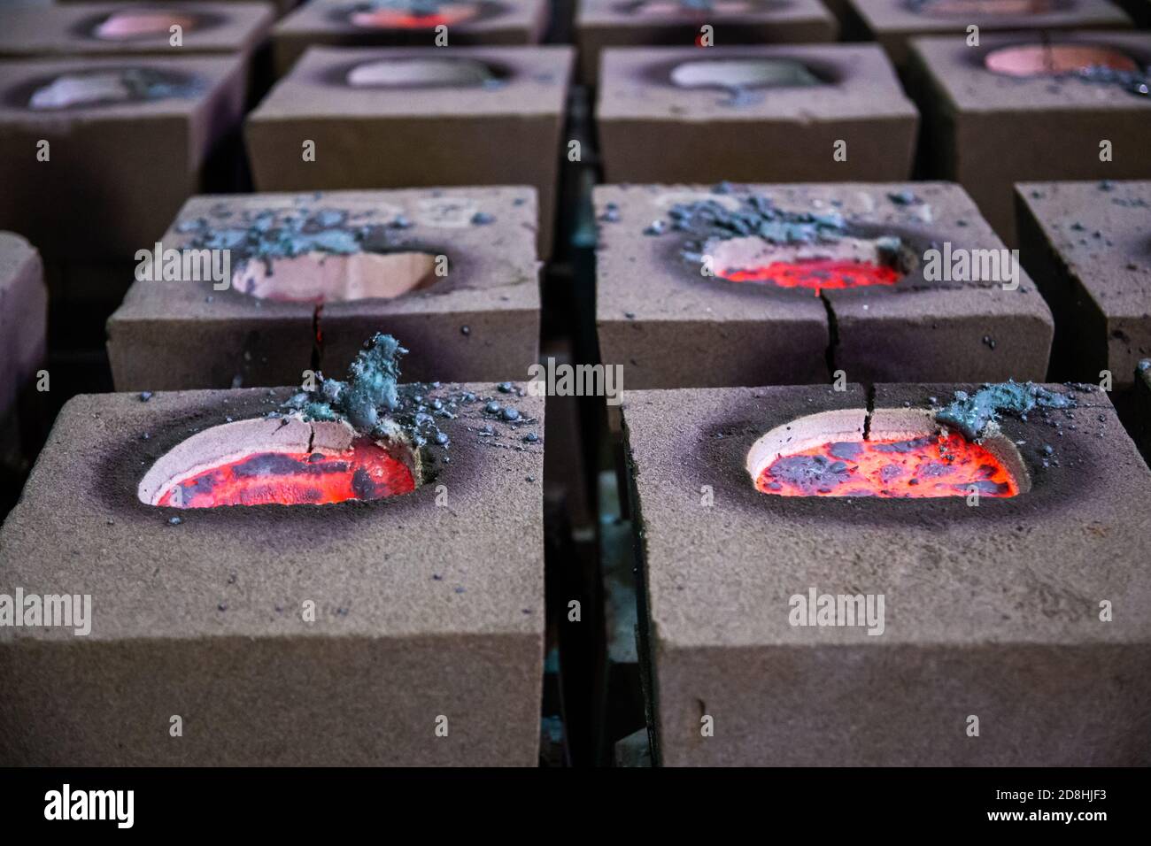 Cooling process of filled sand molds after steel casting, cracked ...