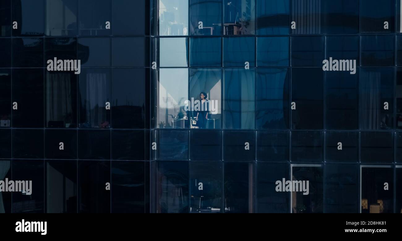 Aerial Shot from the Outside Into Office Building with Businessman ...
