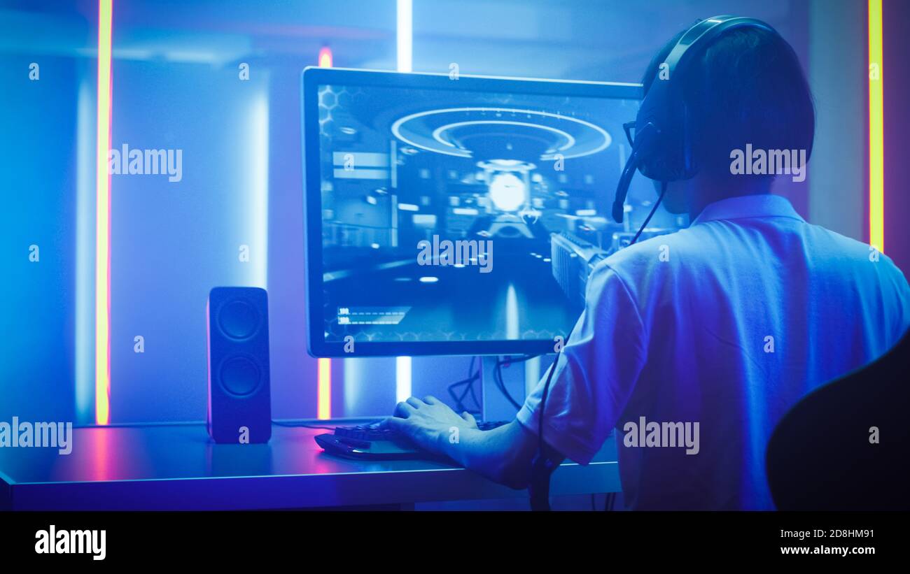 Arc Shot of the Professional Gamer Playing in First-Person Shooter ...