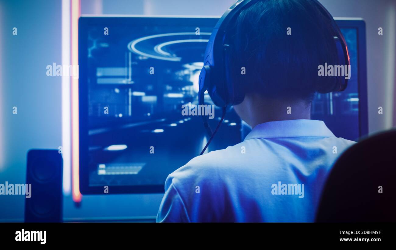 Professional Gamer Playing in First-Person Shooter Online Video Game on ...