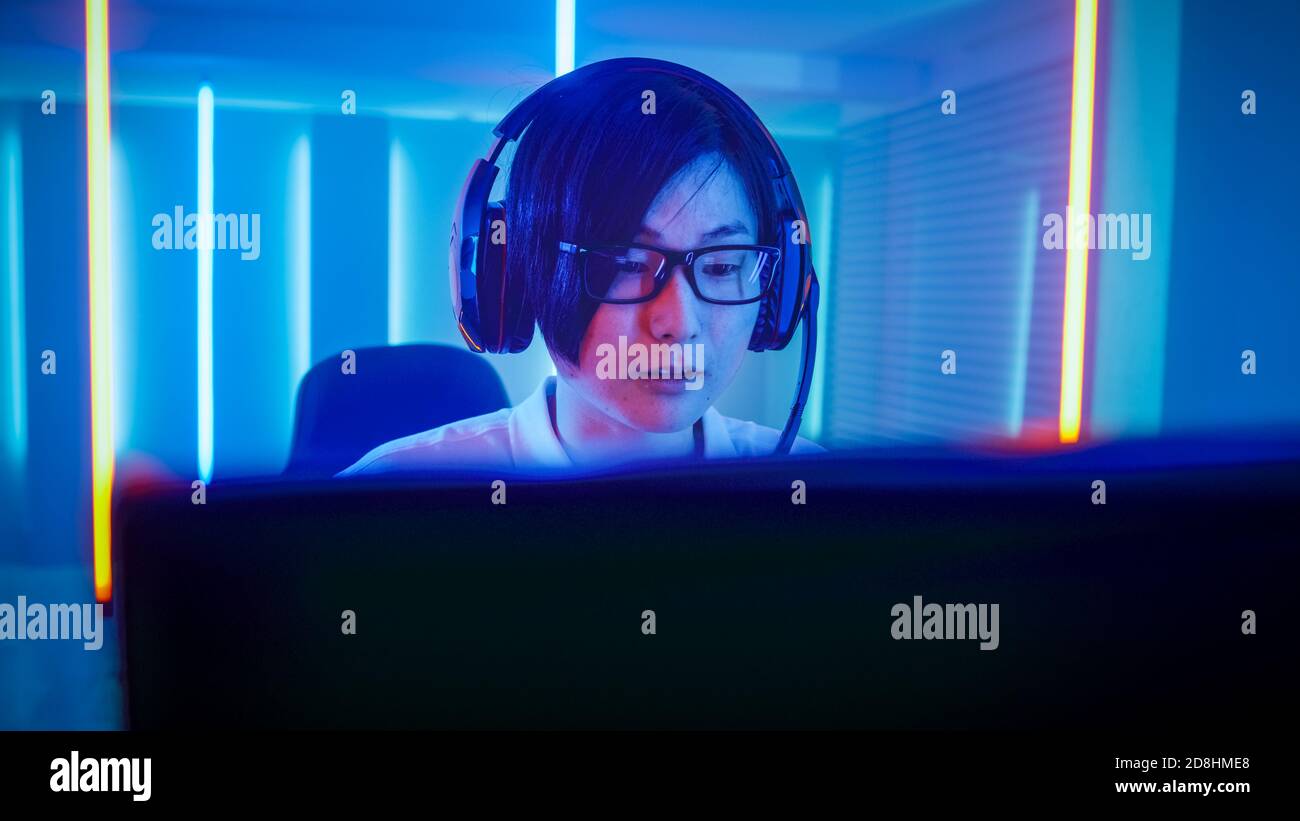 Professional East Asian Gamer Playing in Online Video Game on His ...