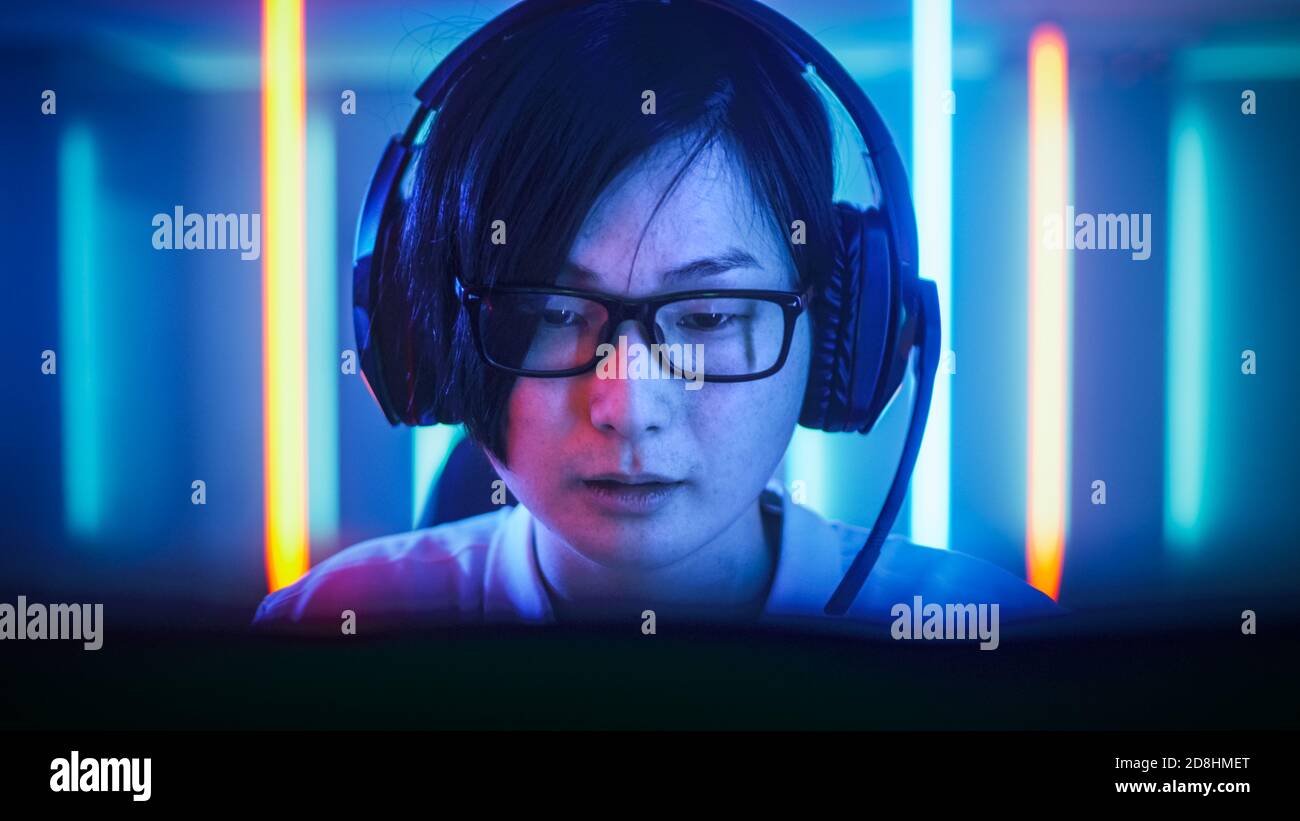 Professional East Asian Gamer Playing in Online Video Game on His ...