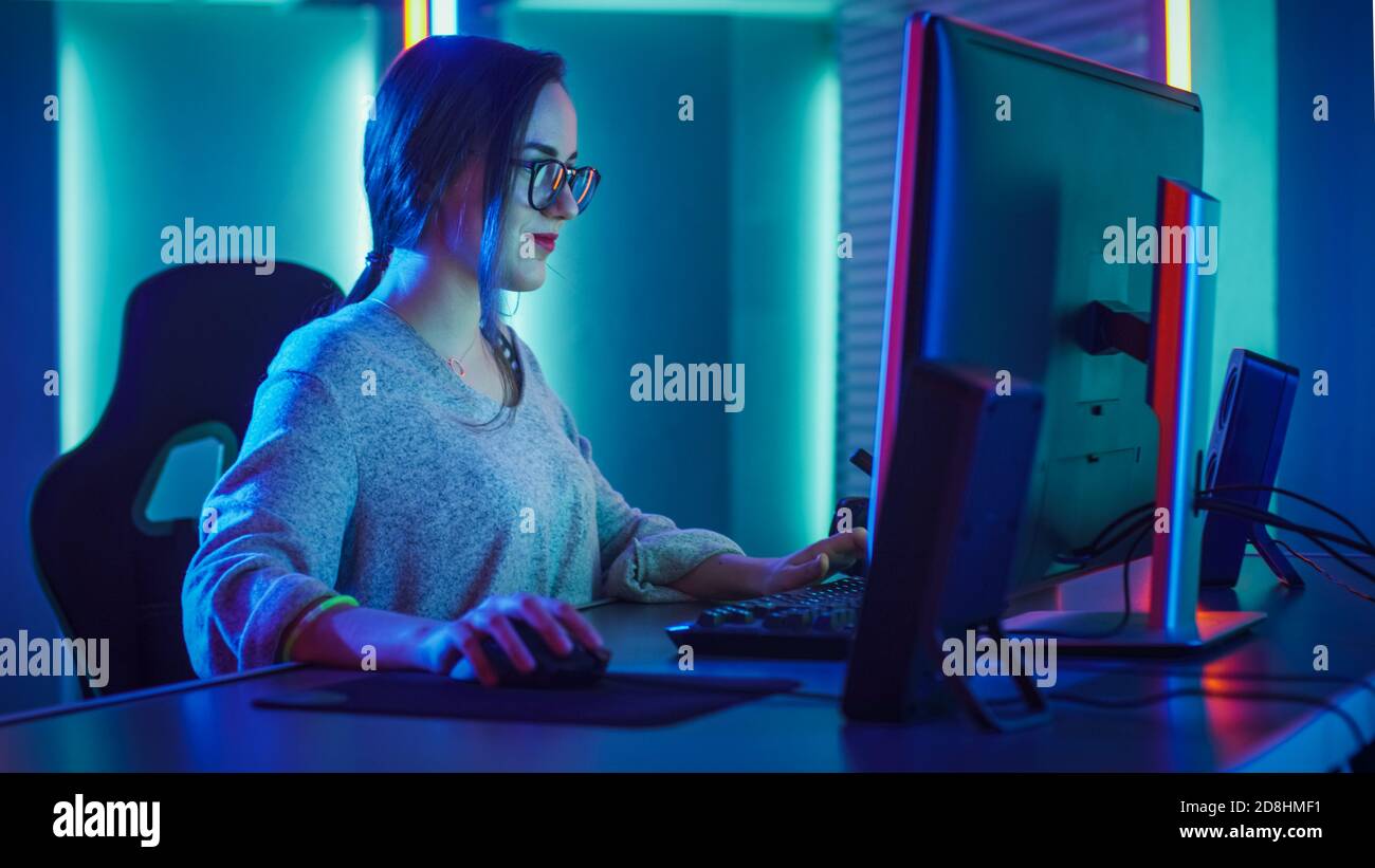 Beautiful Professional Gamer Girl Sitting Down to Play in First-Person ...