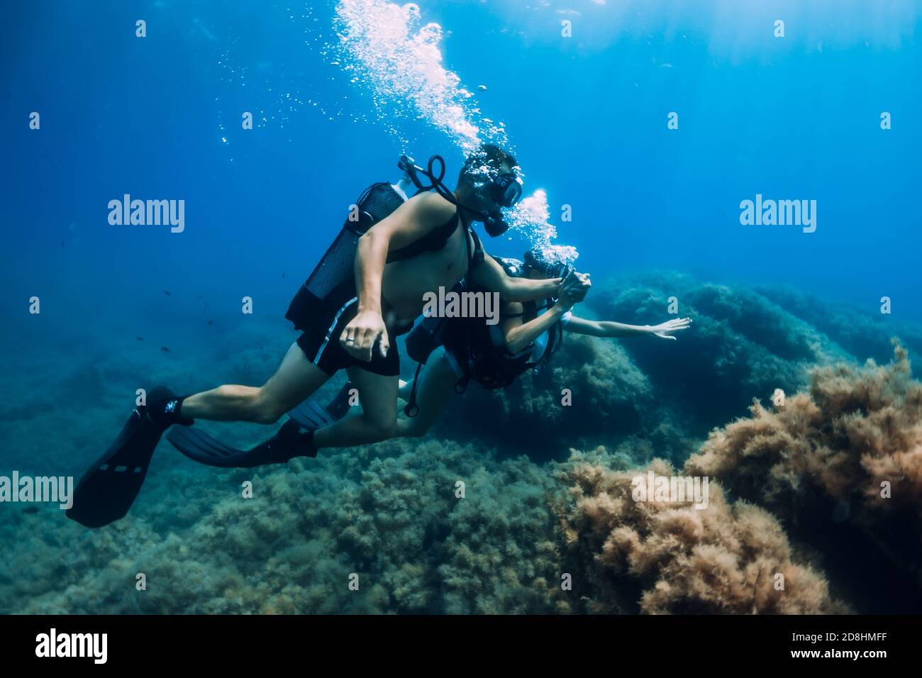 August 20, 2020. Anapa, Russia. Couple of scuba divers glides ...
