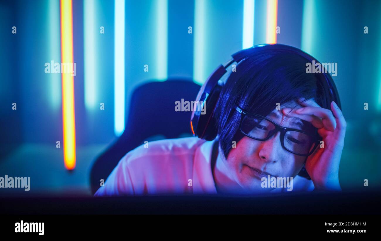 Professional East Asian Gamer Playing in Online Video Game on His ...
