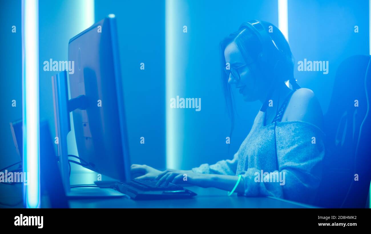 Beautiful Professional Gamer Girl Plays in First Person Shooter Video ...