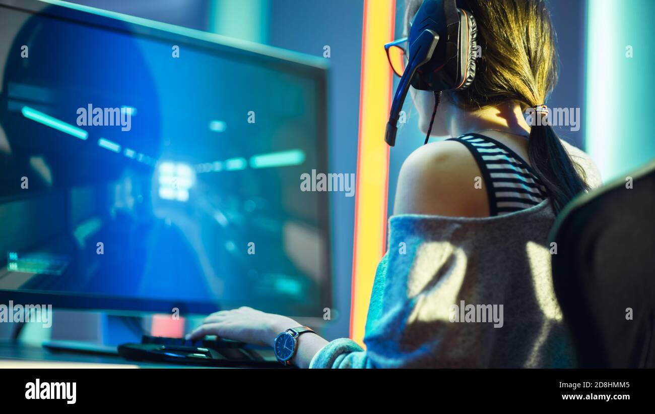 Shot of the Beautiful Pro Gamer Girl Playing in FPS Video Game on Her ...