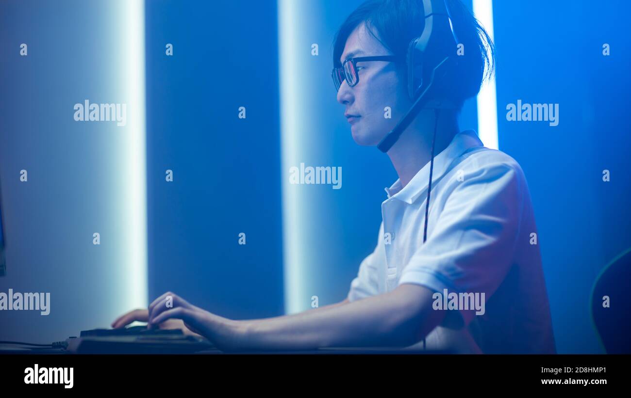 Shot of Professional Gamer Playing Video Game on His Personal Computer ...