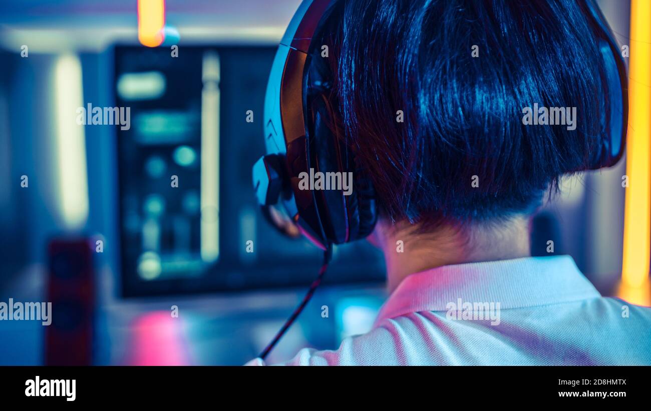 Close-up Back View Portrait Shot of the Professional East Asian Gamer ...