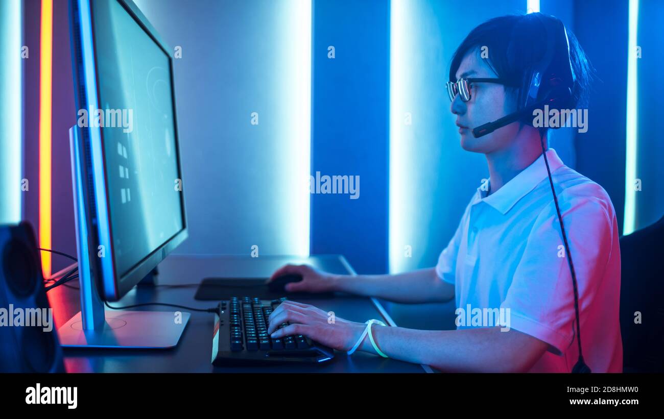 Side View Shot of Professional Gamer Playing in First-Person Shooter ...