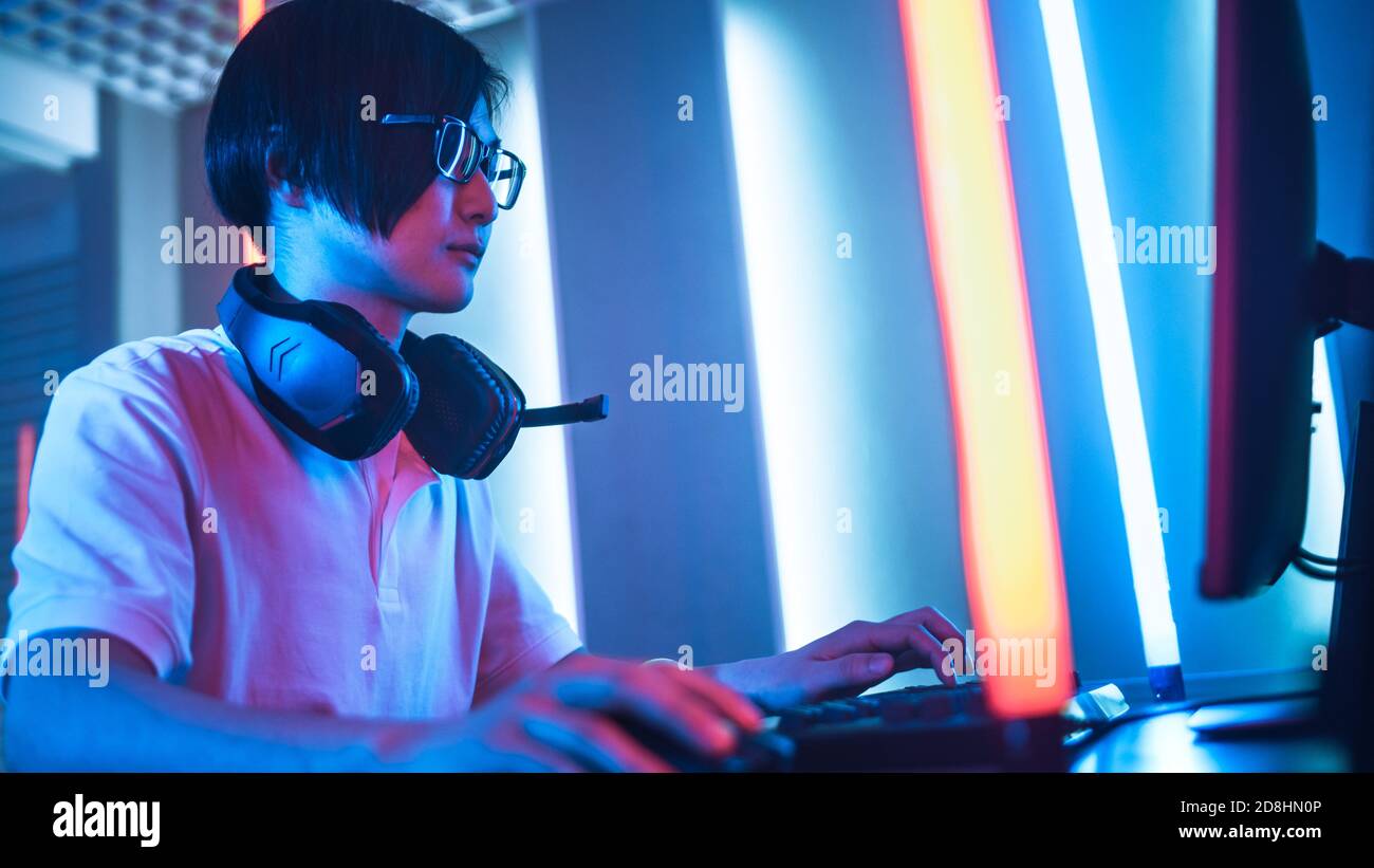 Professional East Asian Gamer Playing in Online Video Game on His ...