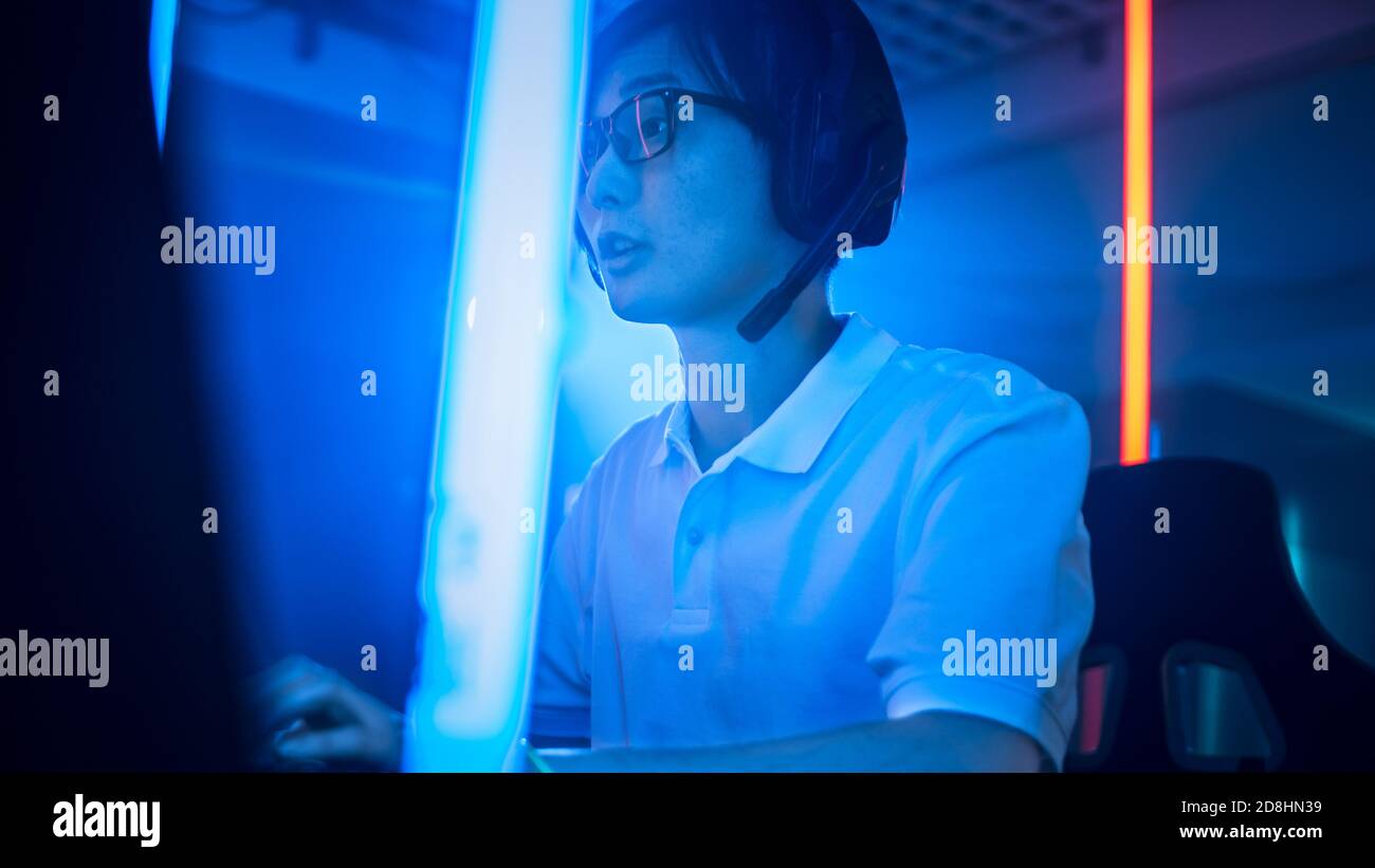 Low Angle Shot of a Professional East Asian Gamer Playing in Online ...