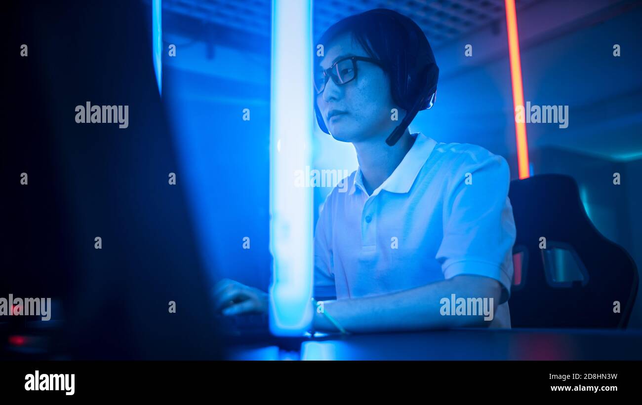 Low Angle Shot of a Professional East Asian Gamer Playing in Online ...