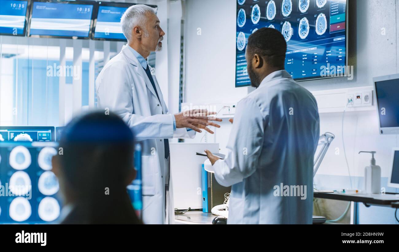 Team of Scientists Work in the Brain Research Laboratory, Discussing ...