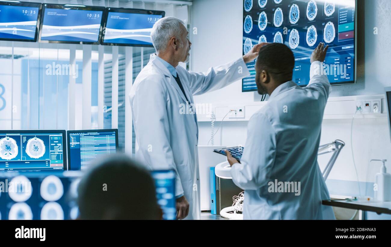 Team of Scientists Work in the Brain Research Laboratory, Discussing ...